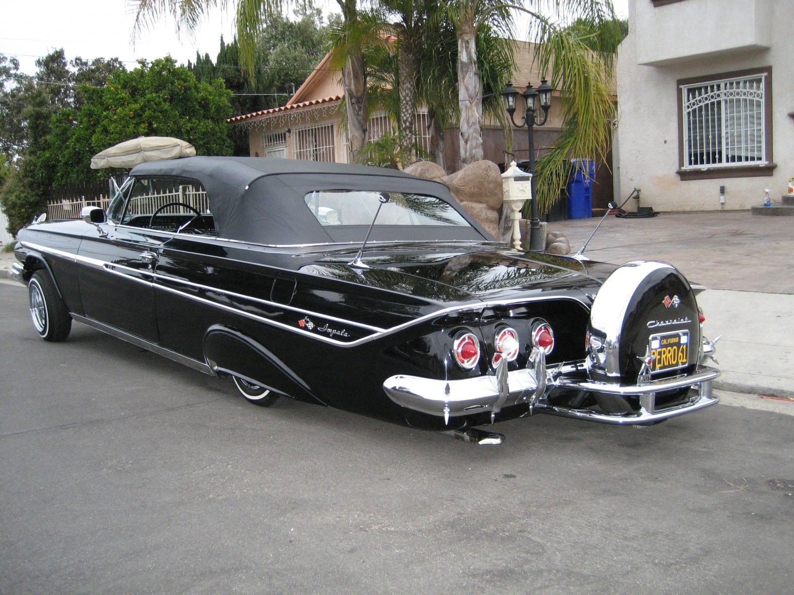 77 - 1961 Chevrolet Black Convertible | Continental Enterprises